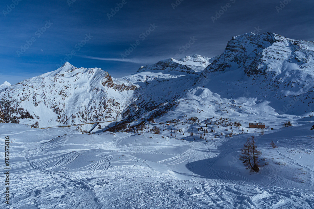 The Simplon Pass, snowy with the peaks of the Lepontine Alps and the ...