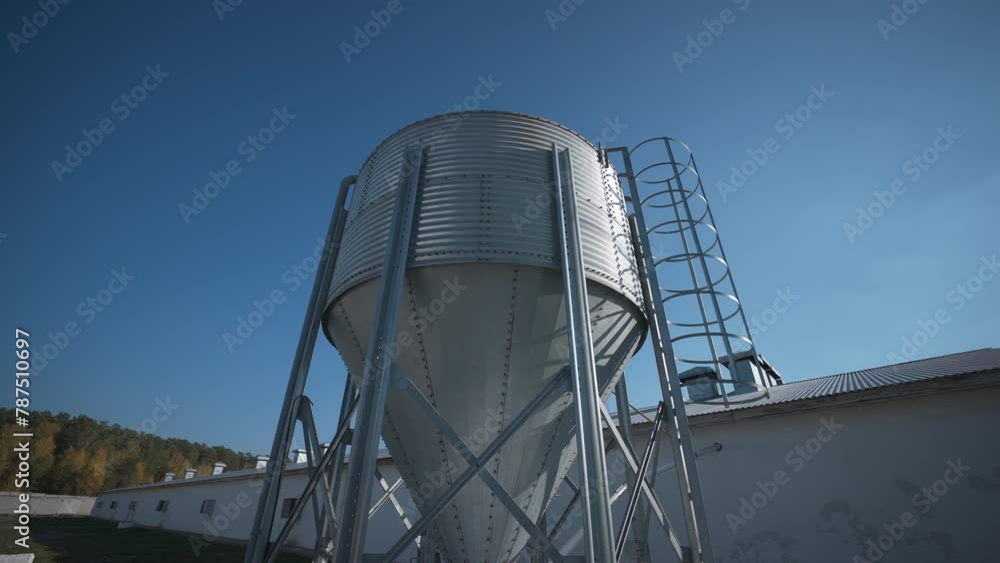 Huge metal farm silo tower used for barley grain storage for animal ...