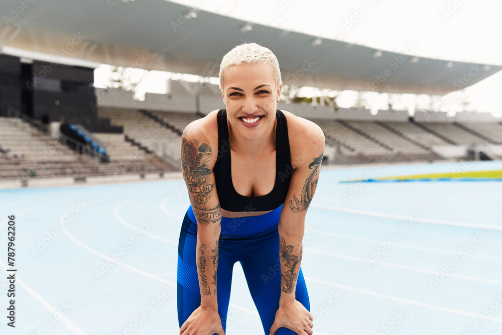 Woman, portrait and athlete with confidence on track field for health ...