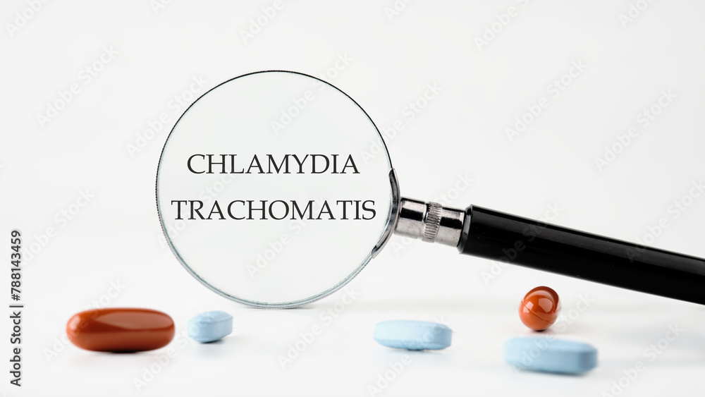 Chlamydia trachomatis on a white background through a magnifying glass ...