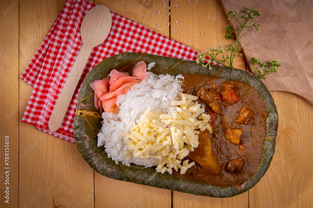 japanese food with recycle biodegradable leaf plate. cheese curry place ...