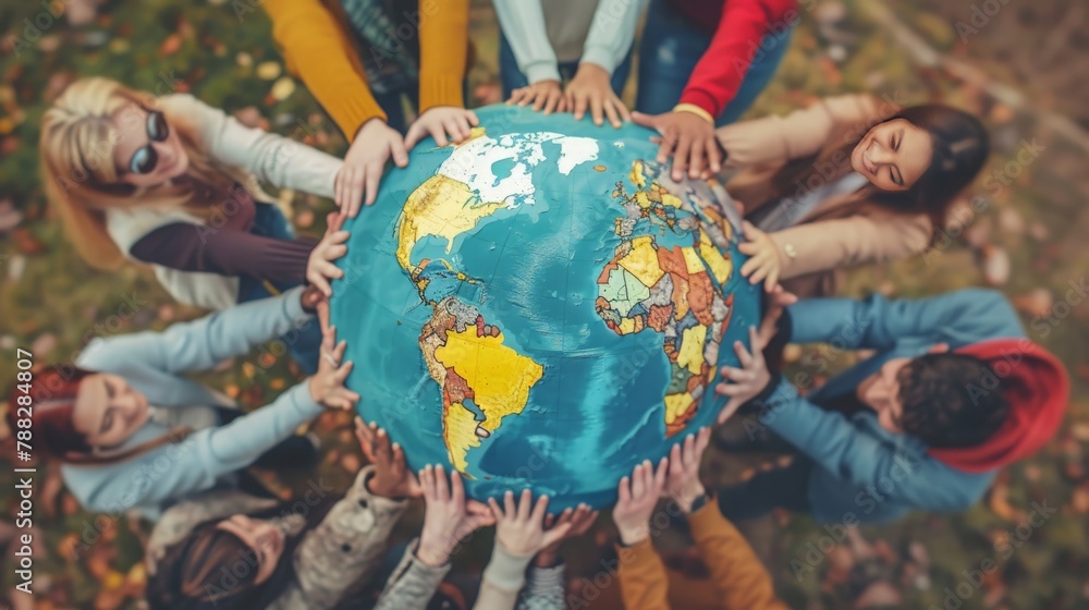 A group of diverse people forming a human chain around a globe ...