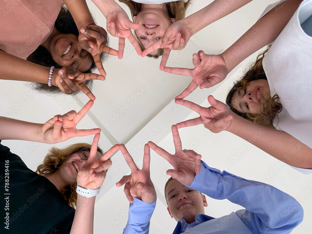 Hands of young people in the shape of a star made of fingers. Teens ...