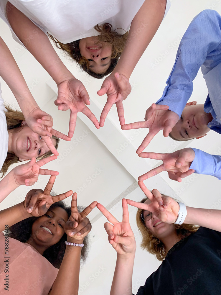 Hands of young people in the shape of a star made of fingers. Teens ...