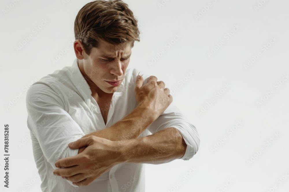 Elbow pain: Observing the man's facial expression of pain, it was clear ...