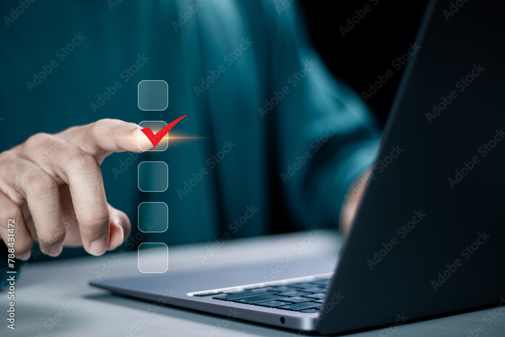 Checklist concept. Businessman using laptop tick correct mark in ...