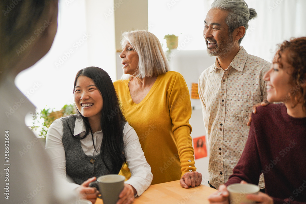 Group of multiracial people having fun drinking coffee together inside ...