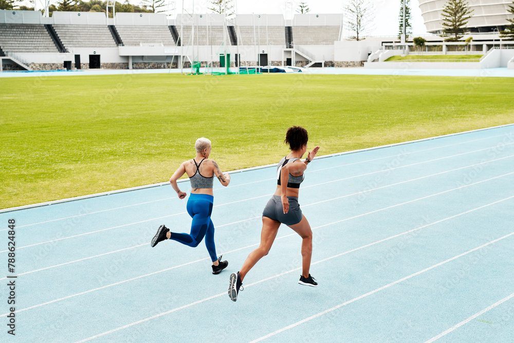 Race track, fitness and women running at stadium with energy, speed and ...