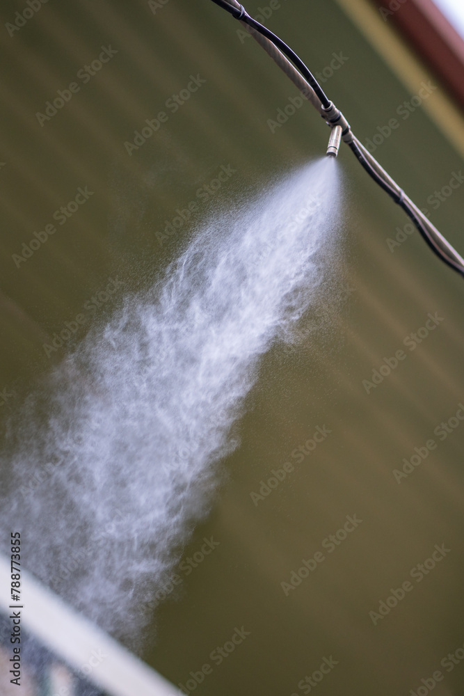 Fogger machine closeup. Automatic mist nozzle water spraying system to ...