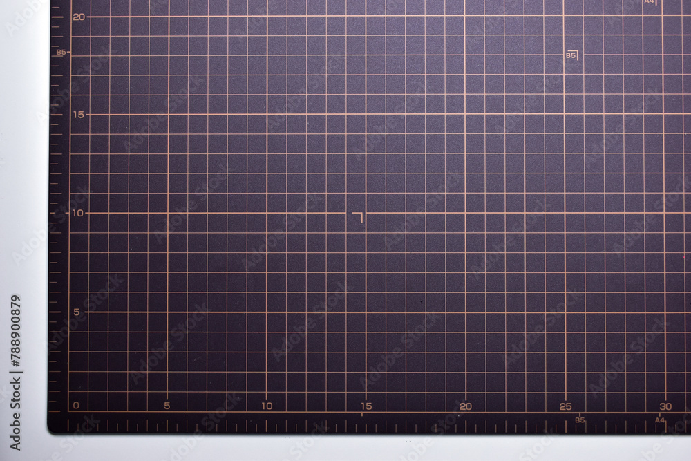 black cutting mat board on white background with line and scale measure ...