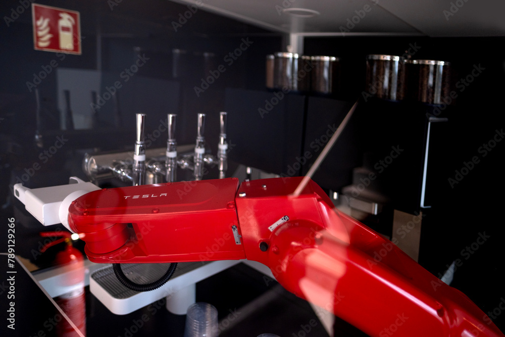 red programmable Tesla robotic mechanical arm with similar functions to ...