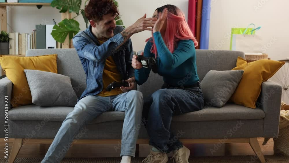 A young couple shares a moment of joy and competition, immersed in a ...