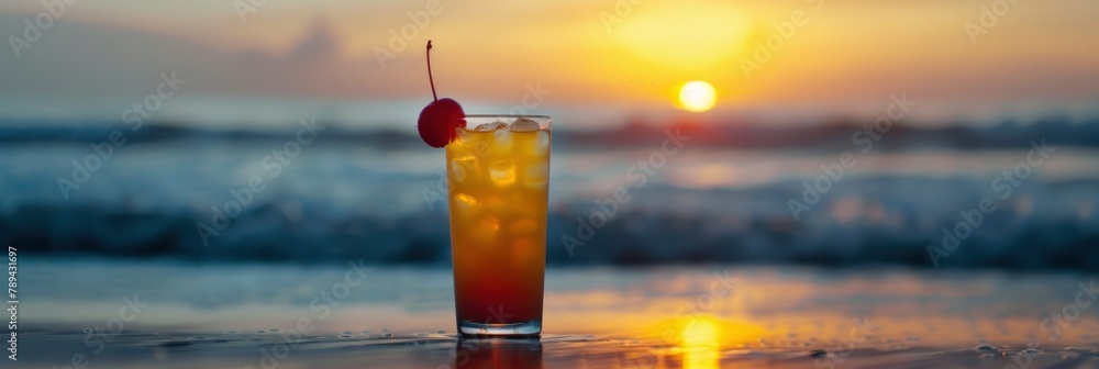 Tequila sunrise cocktail on the beach , highlighting its striking ...