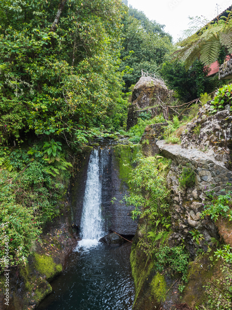 Waterfall at hiking trail PR10 Levada do Furado along water irrigation ...