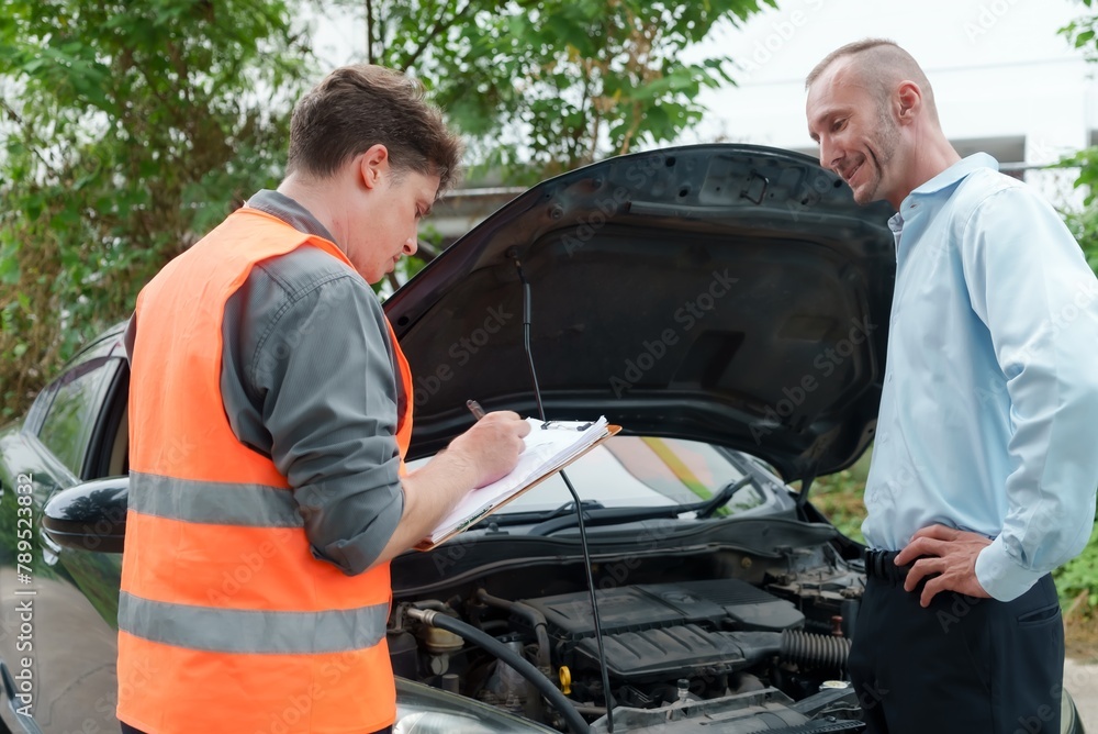 Insurance agent personnel wear orange reflective safety suits. Talking ...