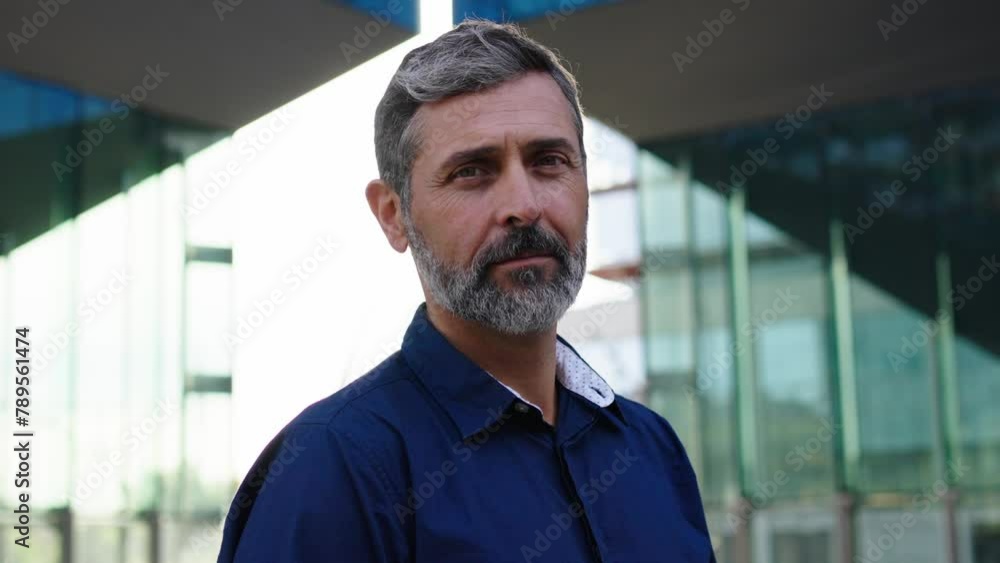 Mature grey hair Caucasian formal business man walking and looking at ...