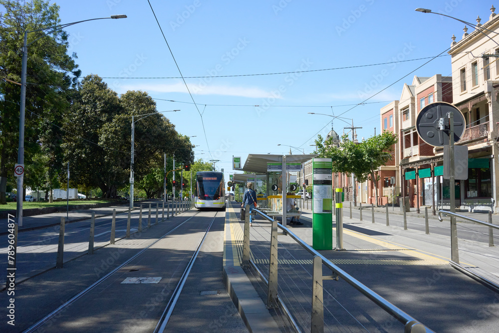 Melbourne streetscape with tram stop and tram Stock Photo | Adobe Stock