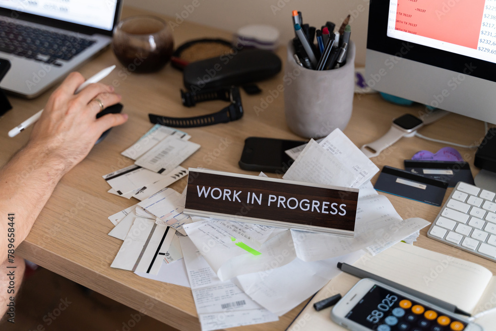 man works online at messy workplace with receipts, invoices Stock Photo ...
