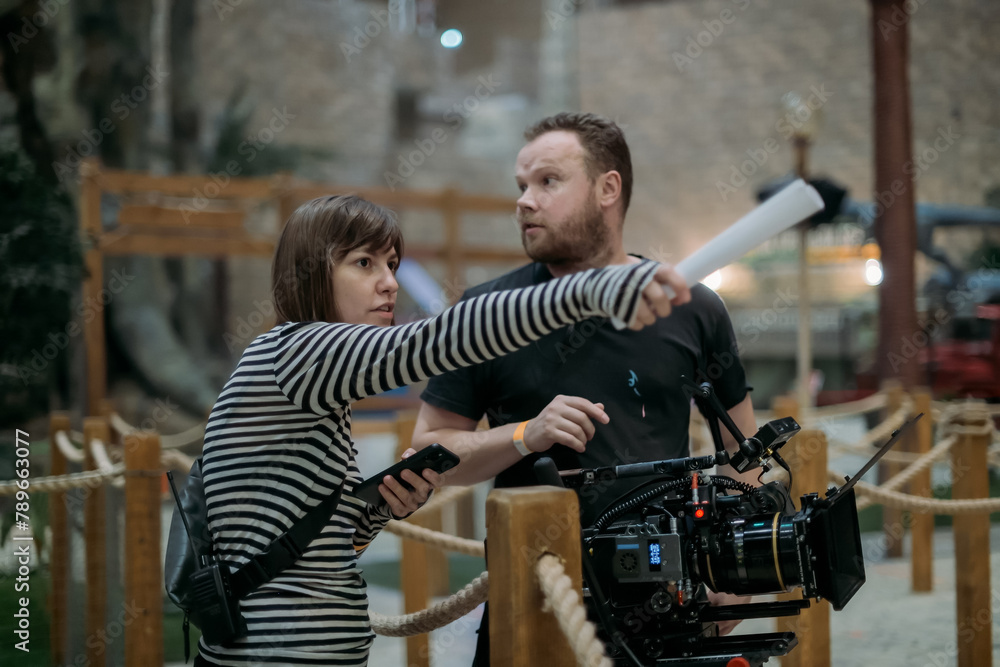 Director at work on the set. The director works with a group or with a ...