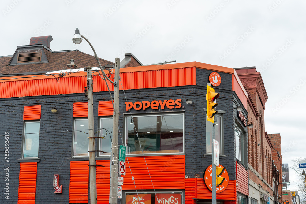 exterior and sign of Popeyes Louisiana Kitchen, a chicken restaurant ...