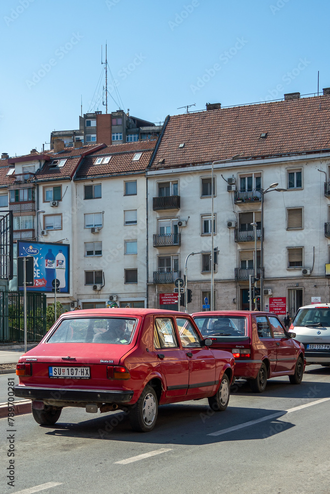 Typical balkan cars - red Zastava Scala 55 and Yugo Koral in street of ...
