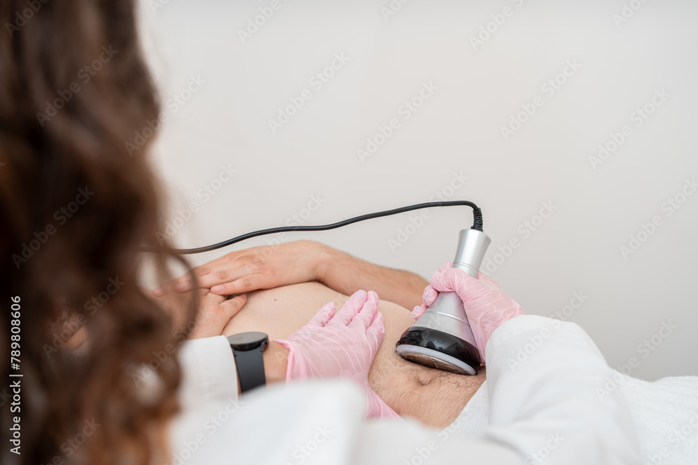 Targeted cavitation treatment for abdominal fat reduction in male ...