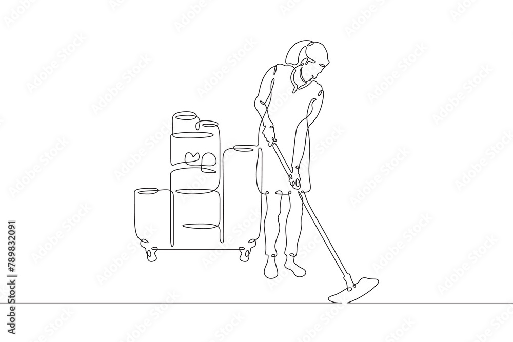 The cleaning lady washes the floor. Cleaning the premises. A woman with ...