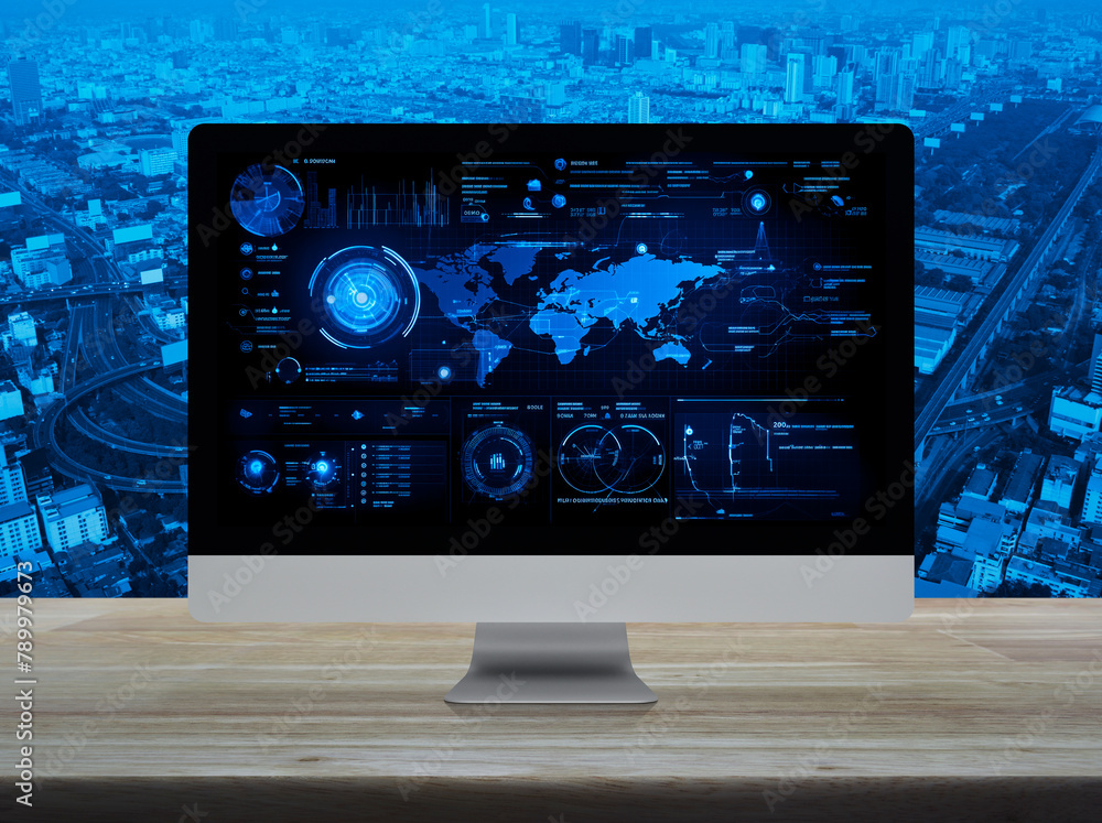 Computer with digital world map with data charts and stats screen on ...