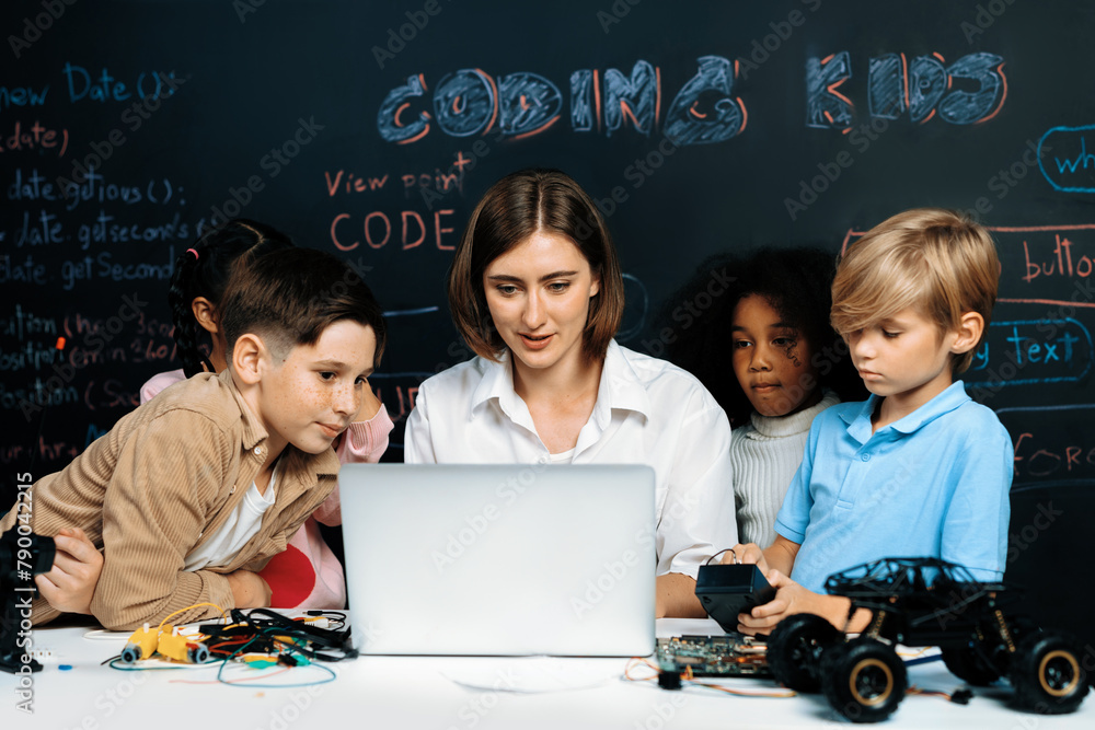 Teacher coding to demonstrate children how to code robots in the STEM ...