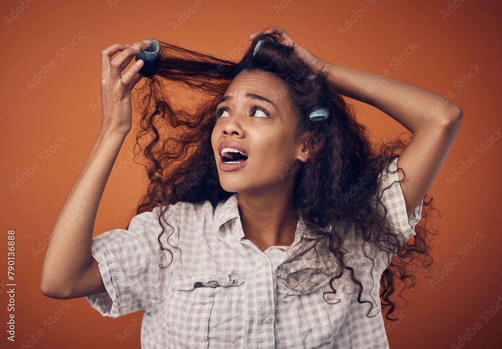 Woman, hair roller and stuck or disappointed with damage in studio on ...
