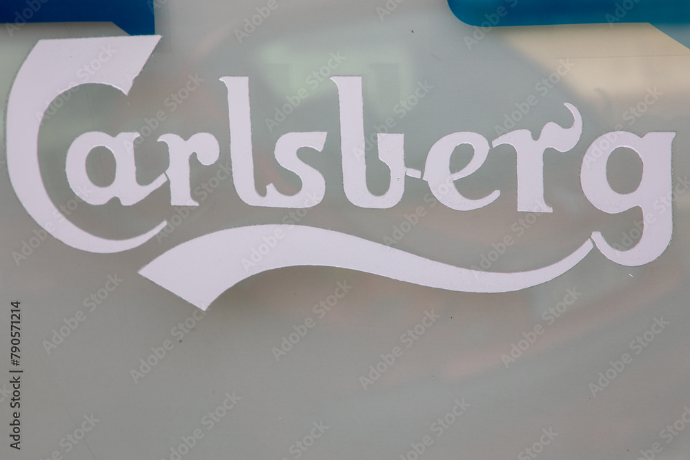 Carlsberg beer irish sign text and brand logo on windows facade wall ...