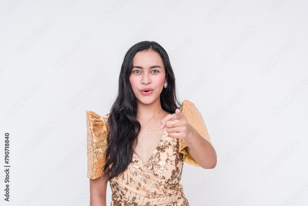 Filipino woman in traditional Filipiniana dress pointing forward ...