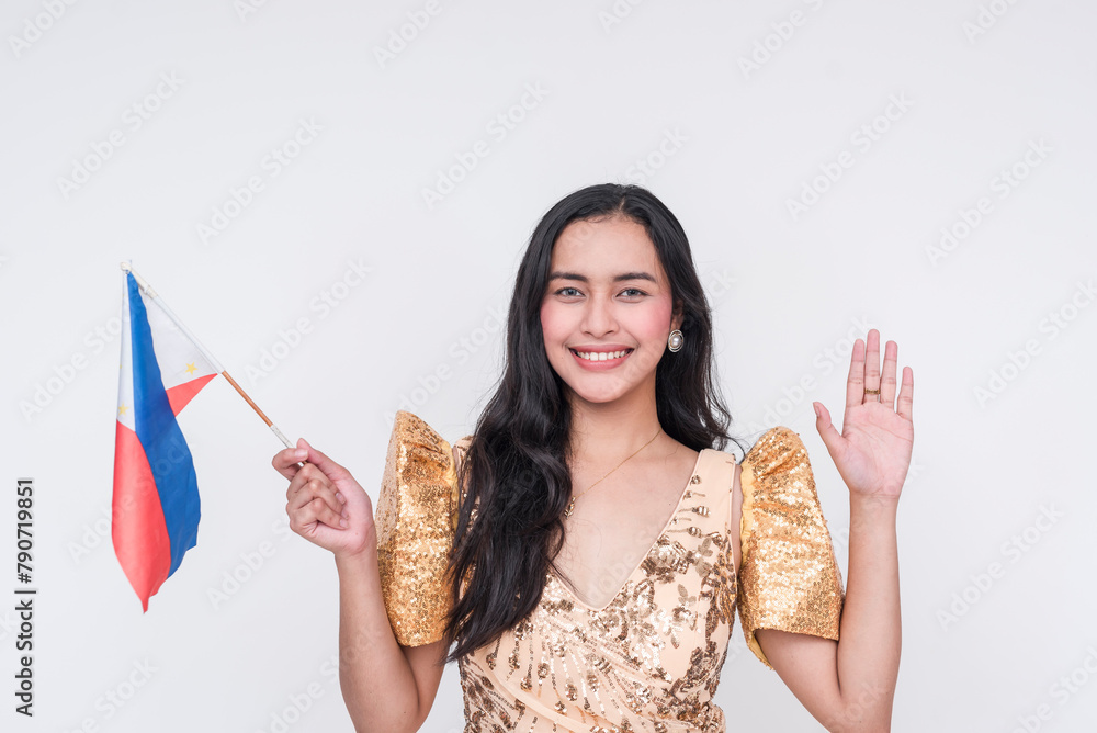 Proud Filipino woman in traditional Filipiniana dress holding the ...