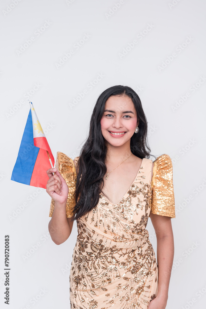 Proud Filipino woman in traditional Filipiniana dress holding the ...