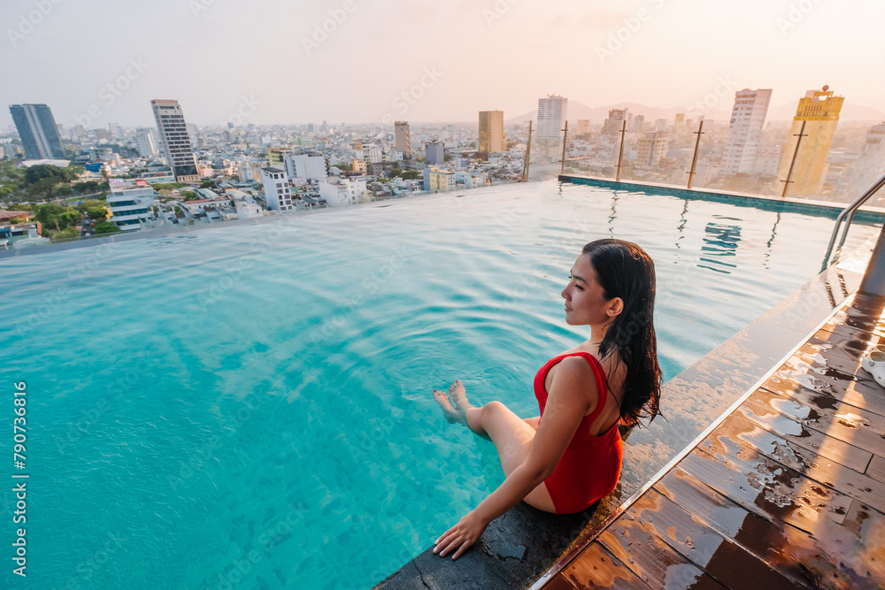 Asian people relaxing in the swimming pool with Han River view and ...