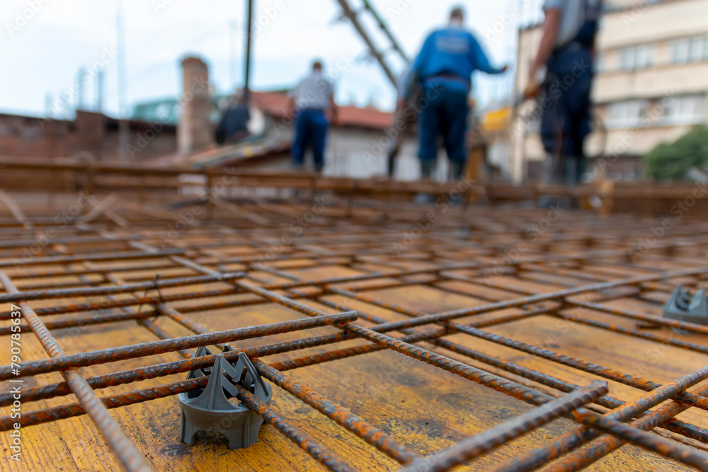 Web of metal rebar or armature steel on the construction site, concrete ...