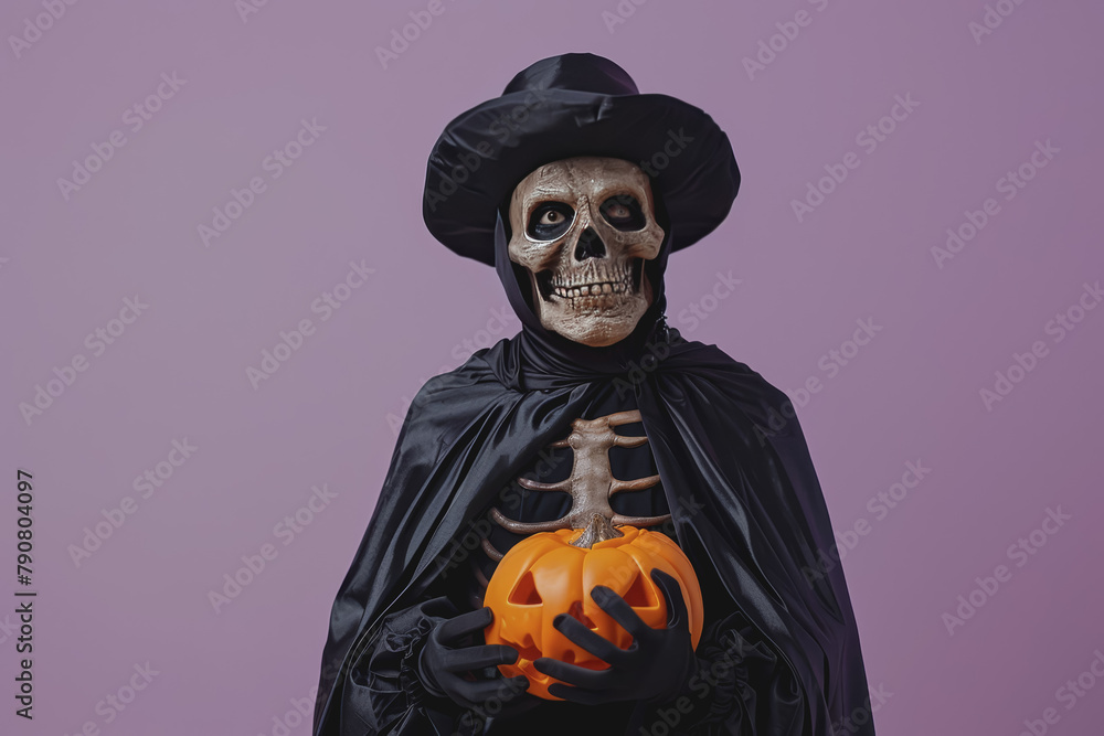 Man in a Halloween costume. A skeleton in a black cloak and top hat on ...