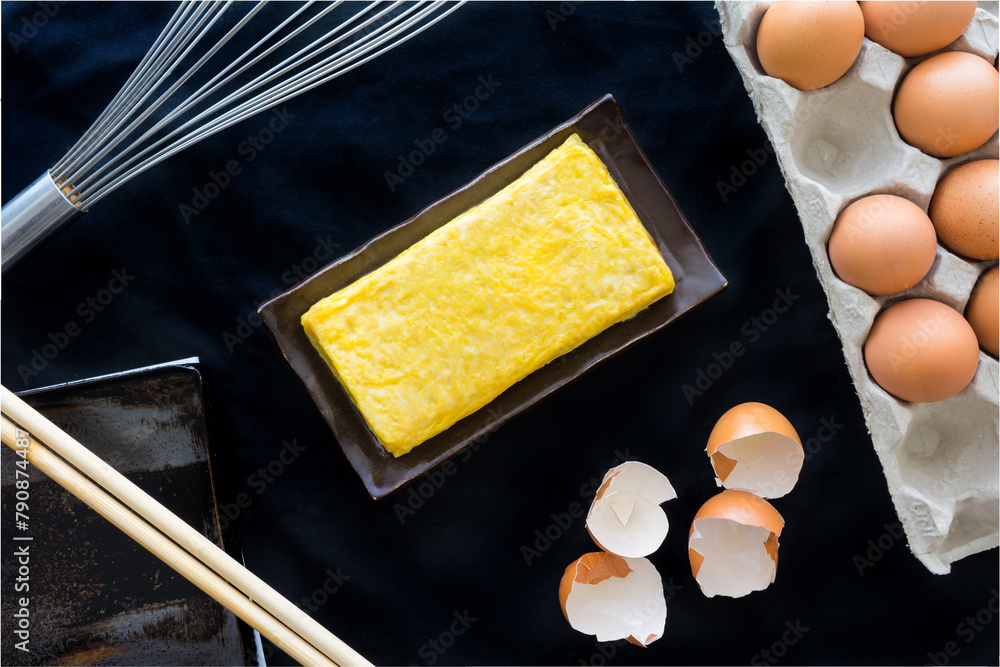 tamago yaki top view with the kitchenware and ingredients.egg roll ...