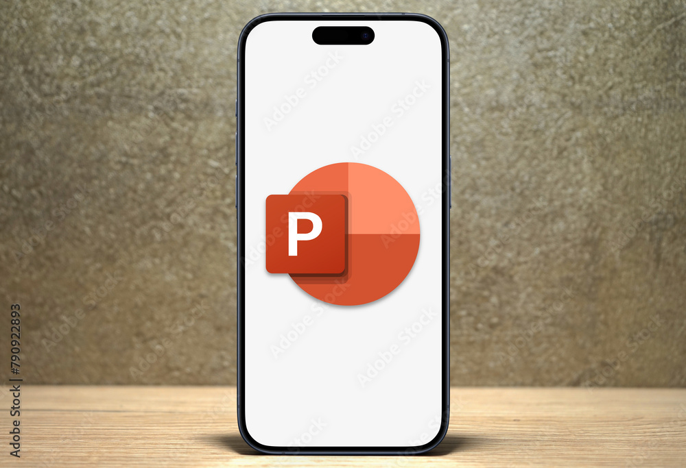 Microsoft PowerPoint logo displayed on a modern smartphone standing on ...