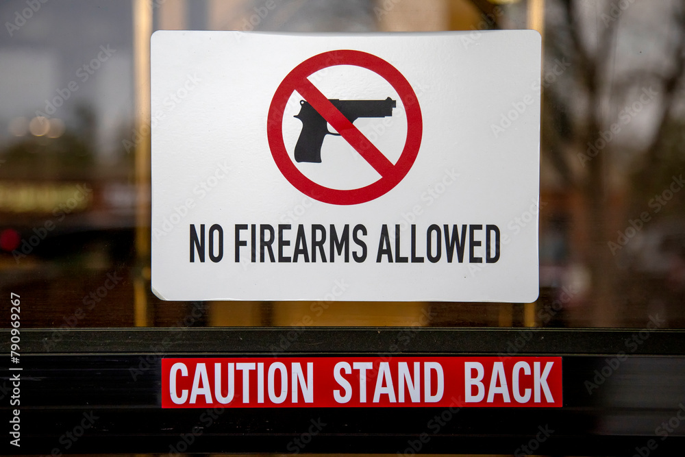 Sign stating No Firearms allowed with red circle and red line and a ...