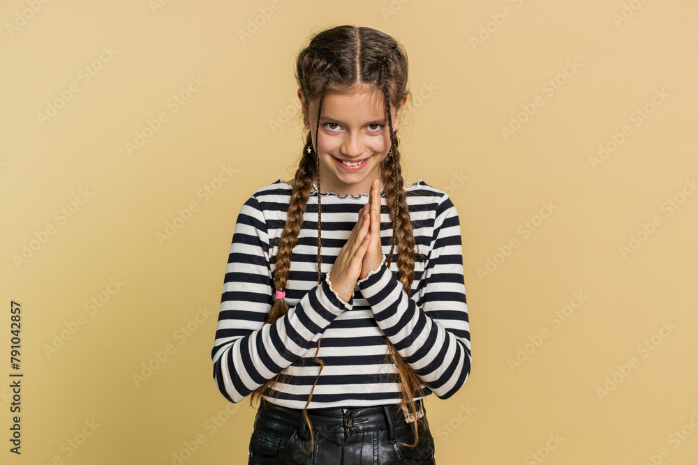 Sneaky cunning preteen child girl kid with tricky face gesticulating and scheming evil plan ...