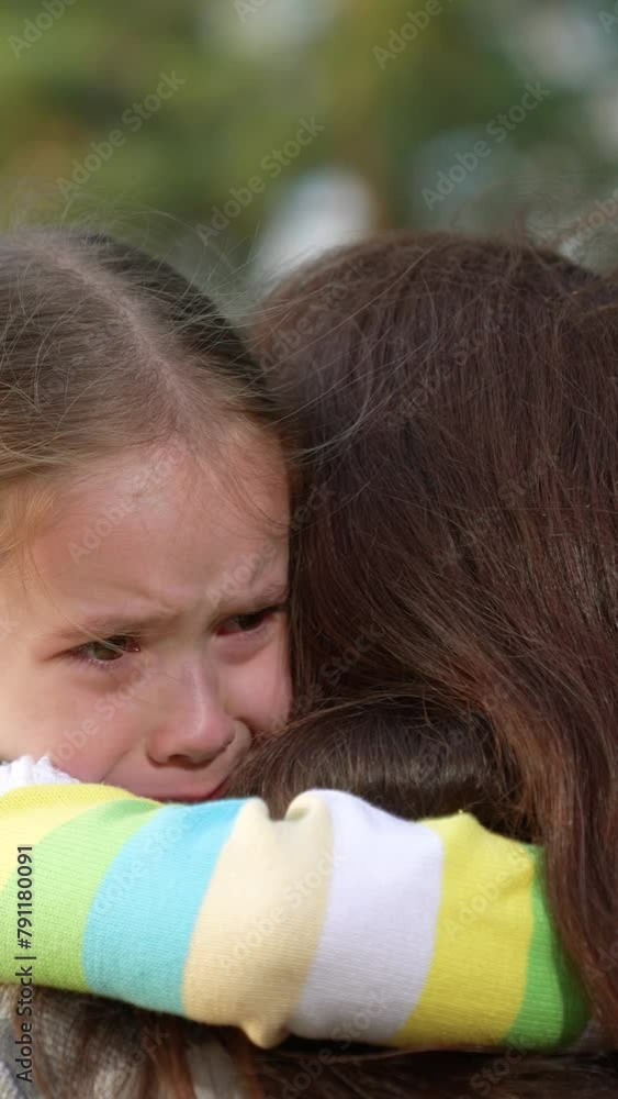 little child cries, tears child face, mother calms capricious kid girl ...