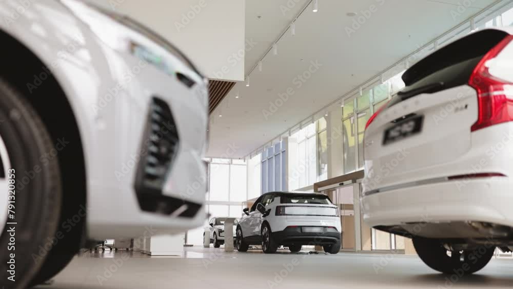 Exterior of new brand fully electric suv car in light dealership ...