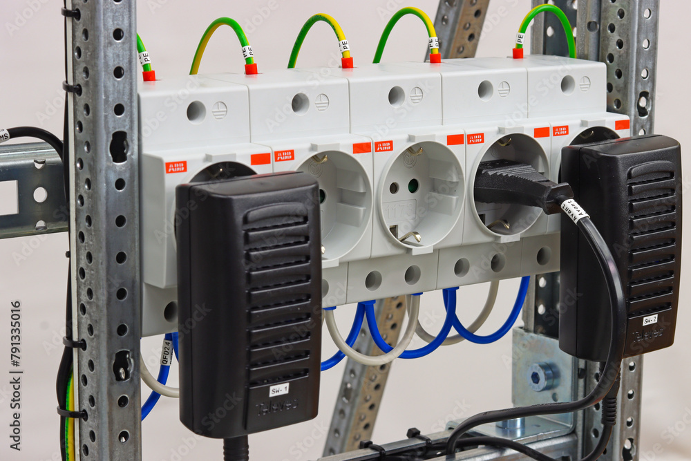 An electric switchboard with modules for protection and control of ...