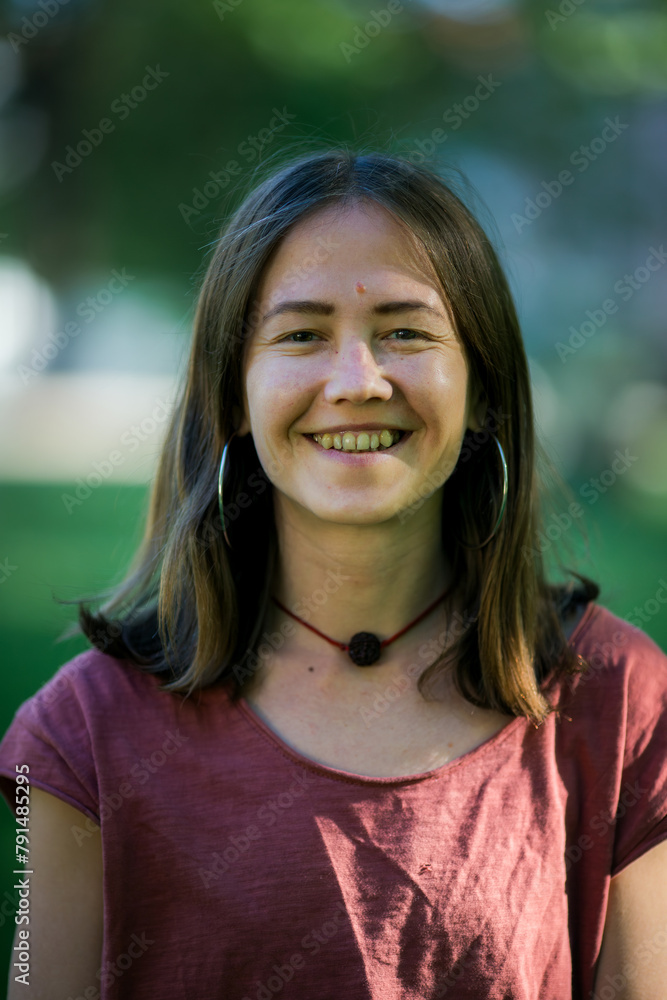 Frontal view with a smile: Facing the camera with a charming smile, the ...