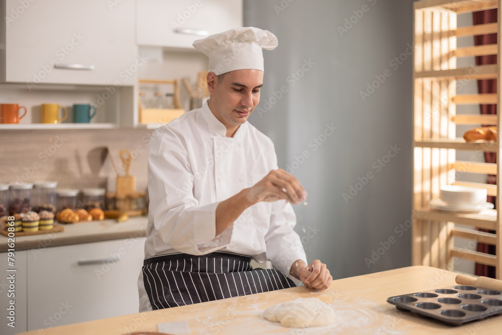 Professional chef kneads dough with expertise. Art of bread-making in a ...