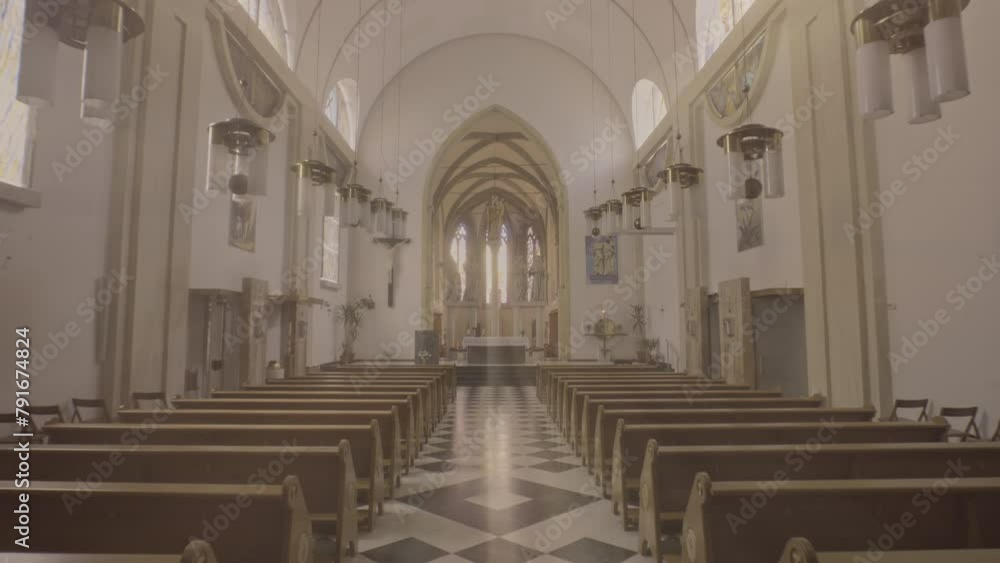 Moving backwards through aisle from altar in empty church. Christian ...