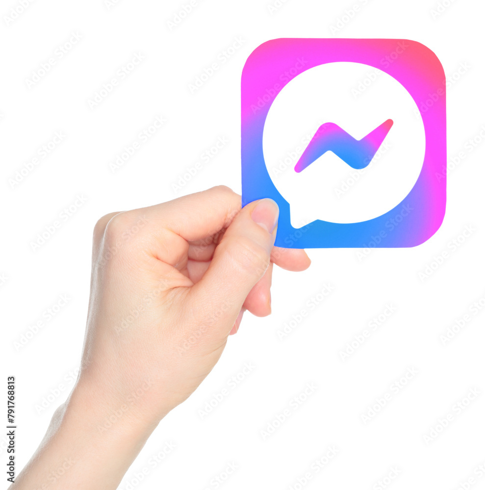 Hand holds paper Facebook Messenger mobile app icon, on transparent ...