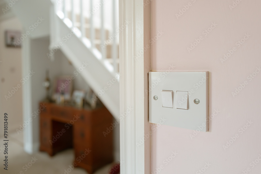 Shallow focus of a two-way light switch seen looking out from the ...