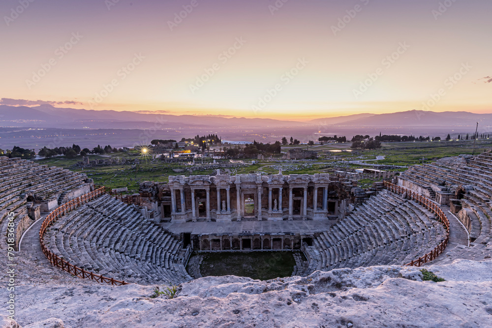 Amphitheater in ancient city of Hierapolis. Dramatic sunset sky. Unesco ...